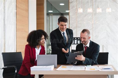 Diverse Business Team Discussing Project At Corporate Briefing In Boardroom Colleagues Meeting
