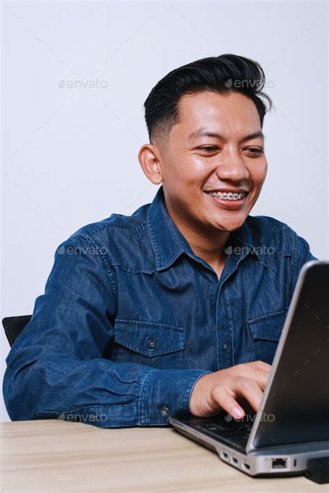 Adult Guy Smile While Using Laptop Stock Photo By Queenmoonlite PhotoDune