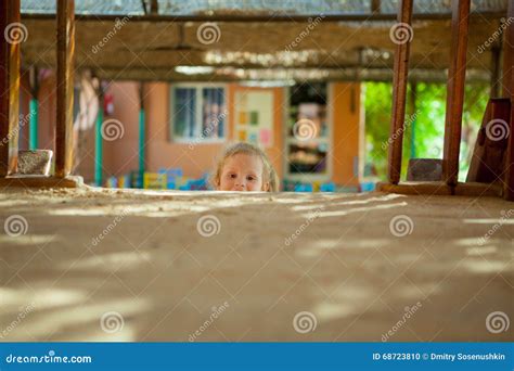 Girl Playing Hide And Seek Stock Photo Image Of Sand