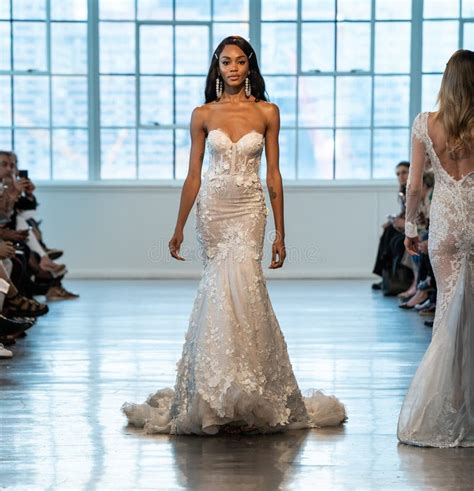 A Model Walks The Runway During The Berta Bridal Spring 2020 Fashion Collection Editorial Image