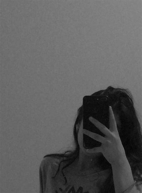 A Woman Taking A Selfie With Her Cell Phone