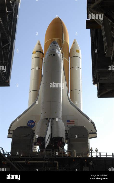 On A Slow Roll Space Shuttle Atlantis Moves Through The Open Door Of