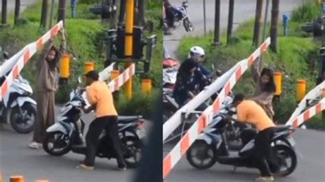 Aksi Heroik Seorang Gadis Bantu Buka Palang Kereta Api Untuk Bantu Pria Yang Motornya Mogok