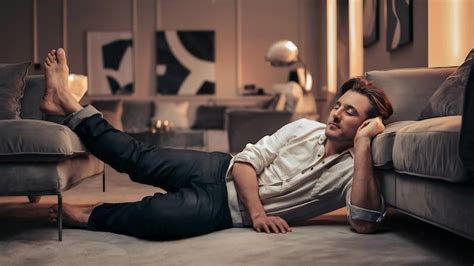 Premium Photo Content Handsome Man Lying On Floor And Relaxing