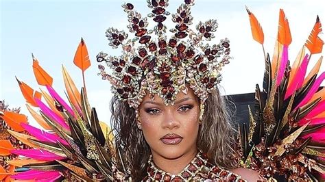 Rihanna ‘nervously Covers Her Stomach With Hands As She Wears Carnival Costume In Barbados