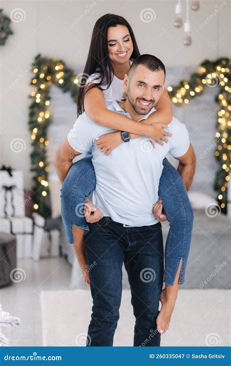 Beautiful Woman Climbed Behind Her Husband S Back And Hugged Him Cute Couple Spend Time At Home