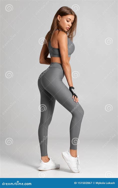 Sexy Fitness Woman Beautiful Athletic Girl Isolated On The Gray Background Royalty Free Stock
