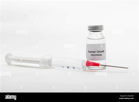 Medical Concept Showing Medical A Medical Vial Reading Human Growth Hormone And A Syringe Stock