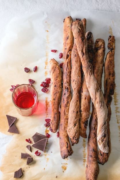 Premium Photo Grissini Bread And Red Liqueur
