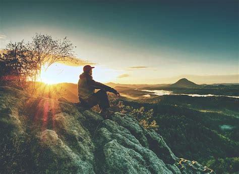 Premium Photo Man Alone Ath Edge Hiker Enjoy View Into Fairy Landscape Sharp Sun Rays