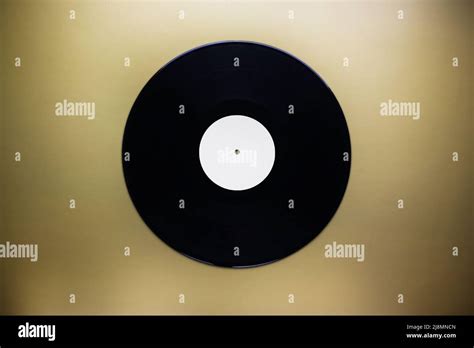 classic vinyl record close up on a yellow background obsolete data