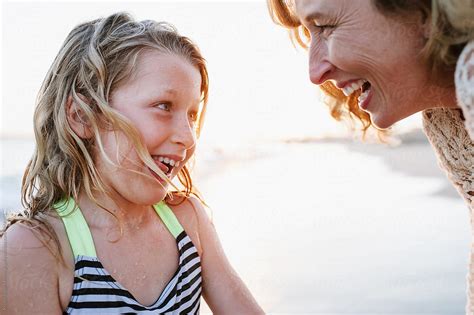 Sweet Moment Of Mom And Daughter On The Beach By Stocksy Contributor