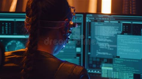 Cyberpunk Girl Works With Multiple Computer Screens Doing Programming