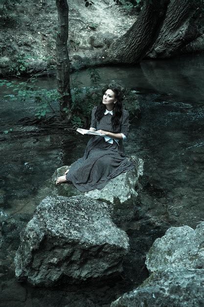 Premium Photo Girl With A Book On The River