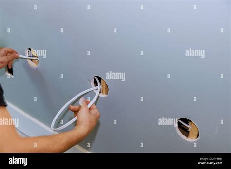 Electrician Is Installing New Current Socket At Construction Site Of