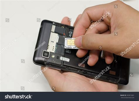 Inserting Sim Card Into Mobile Phone Stock Photo Shutterstock