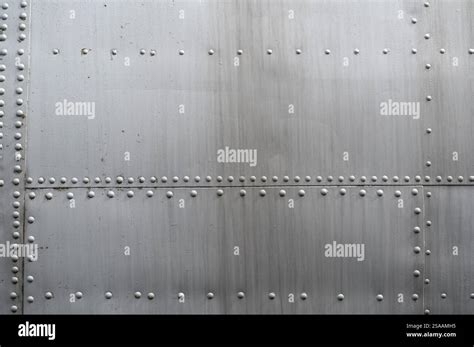 Close Up Of Metal Surface Of An Aircraft Fuselage Showing Complex