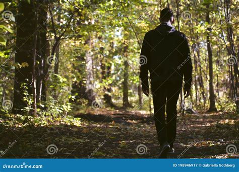 Back Of A Man Walking Into An Autumn Forest Stock Image Image Of Leaves Forest 198946917