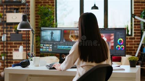 Female Video Editor Focuses On Color Grading While Working On A Film