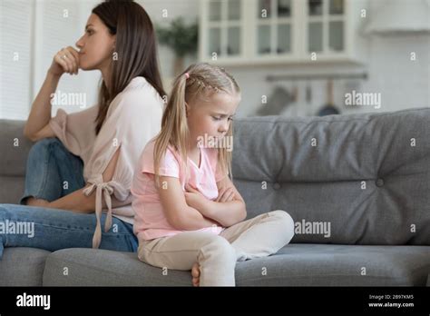 Upset Girl And Mom Ignore Each Other After Fight Stock Photo Alamy