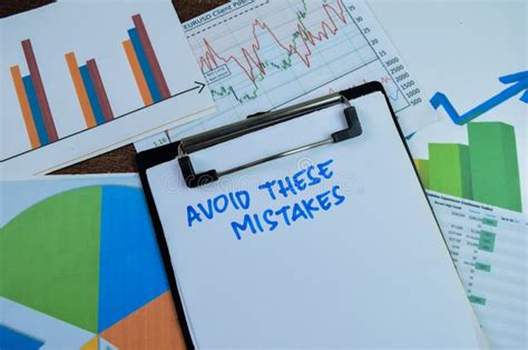 Concept Of Avoid These Mistakes Write On Paperwork Isolated On Wooden Background Stock