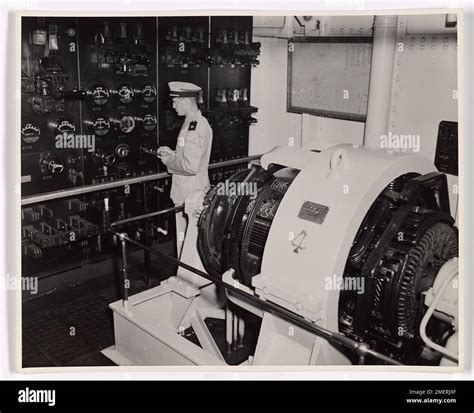 Us Maritime Engineer Cadet In Engine Room Of Large Liner Checking