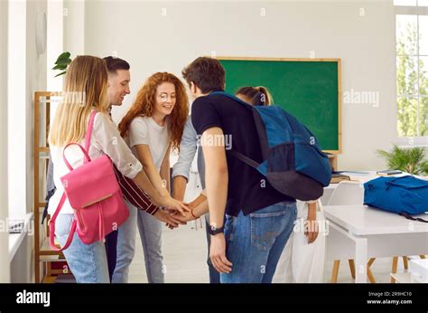 Cheerful College Or High School Students Together Making Stack Of Hands