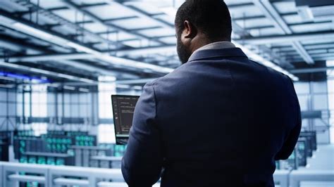 Free Photo Programmer In Data Center Doing Yearly Maintenance Checkup