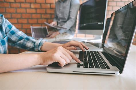 Premium Photo Developer Programmer Cooperation Meeting And Brainstorming And Programming In