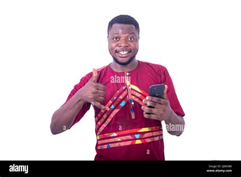 Adult Man Holding Mobile Phone And Making Mobile Phone Gesture Finger And Smiling At Camera