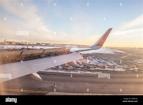 The Plane Is Dressed For Takeoff Aircrafts Wing And Land Seen Through The Illuminator View