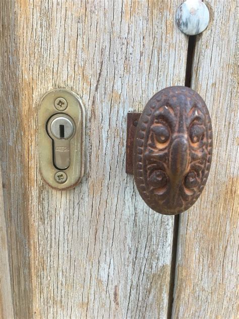 Old Door Handle With A Face Layersoflight