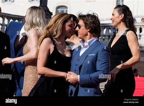 Actor Tom Cruise Shares A Word With Colleague Rebecca Ferguson On The Red Carpet Of The World