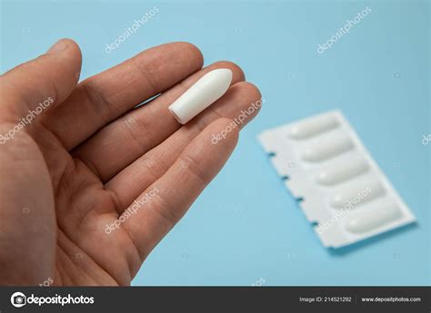 Suppository For Anal Or Vaginal Use In The Hands Of A Man Candles For Treatment Of Hemorrhoids