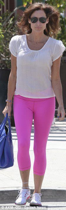 Minnie Driver Brightens Up Her Workout With Neon Pink Leggings Daily