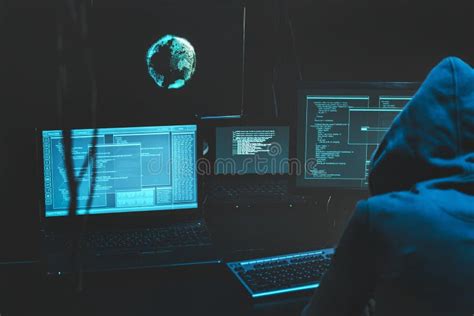 Cyber Criminal Hacking System At Monitors Hacker Attack Web Servers In Dark Room At Computer