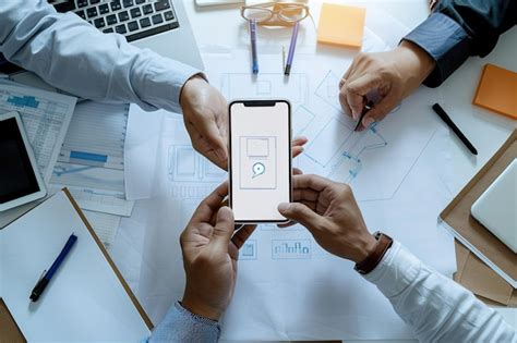 Top View Of Developer Team Designing Ux Ui Design For Mobile Phone Convocation Premium Ai