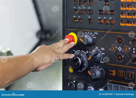 Operator Use Finger Press Emergency Stop Button Of Control Panel Cnc Lathe Machine Stock Image