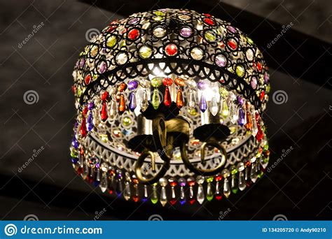 Crystal Chandelier Illuminates The Ceiling In The Room Stock Photo Image Of Shimmers Rays