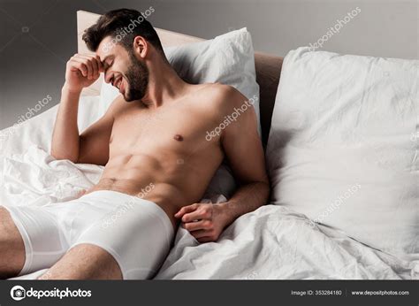 Laughing Handsome Sexy Man Lying Bed Grey Stock Photo VitalikRadko