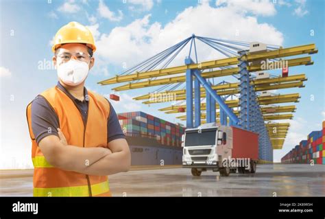 Engineer Or Asian Worker Work At Container Terminal Port Stock Photo Alamy