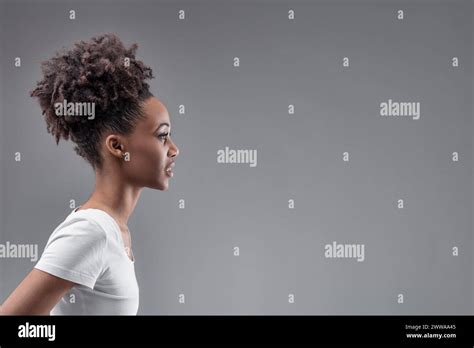 Elegant Woman Captured In Profile Symbolizing Thoughtful Introspection And Determined Poise