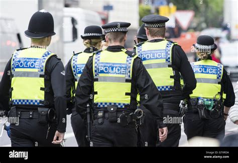 Six British Transport Police Officers Patrol The Street In Highbury Hi