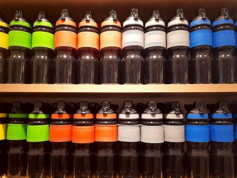 Premium Photo Multi Colored Bottles On Shelf