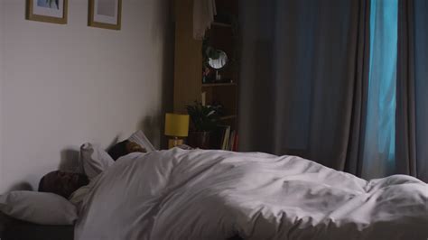 Restless Couple Lying Asleep In Bed At Home At Night Free Stock Video