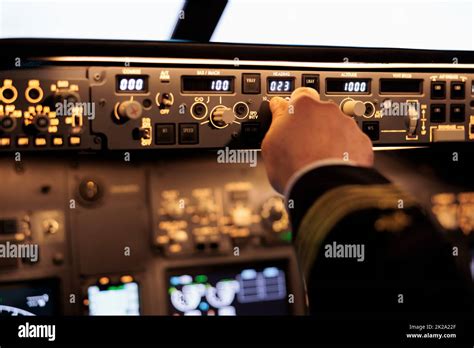 Male Captain Fixing Altitude And Longitude Level On Dashboard In Plane Cockpit Pilot Pushing