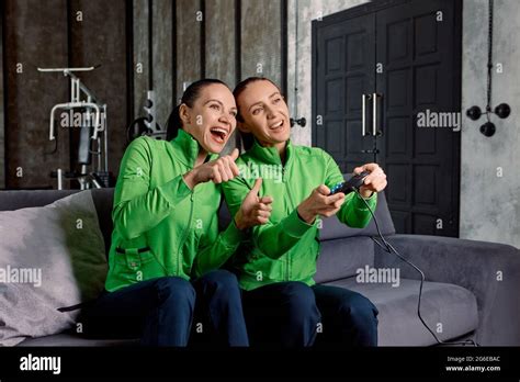 Mature Women Play Video Games Using Game Console And Joystick Stock Photo Alamy
