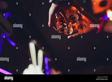 Male Hands Cheer With Glasses Of Shot Or Liqueur Friends Drink Shot Or