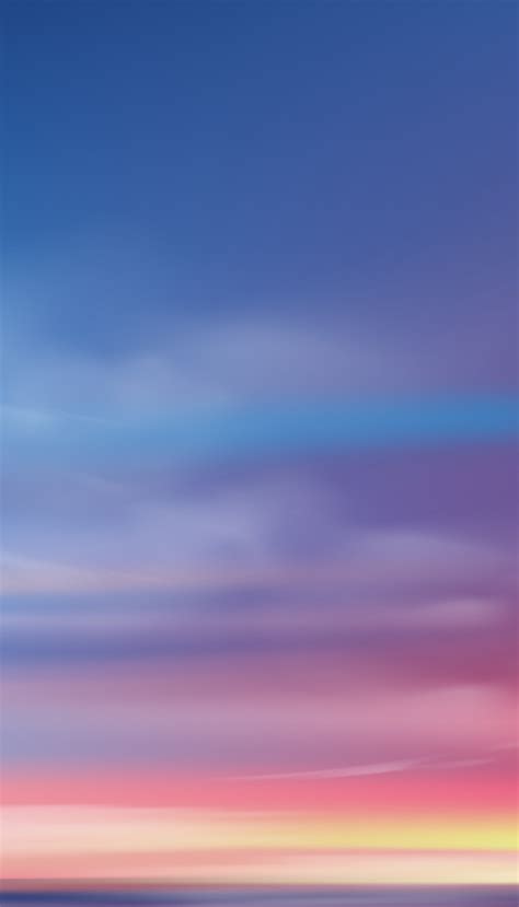 Sunset In Evening With Orange Yellow Pink And Blue Sky Vertical