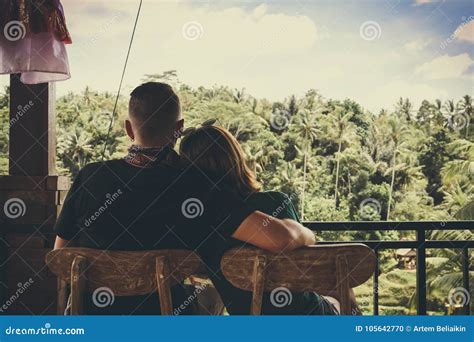 Young Romantic Honeymoon Couple In The Jungle Rainforest Of A Tropical